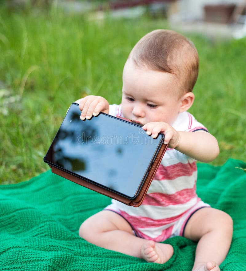 Baby boy with tablet stock image. Image of education - 73593077