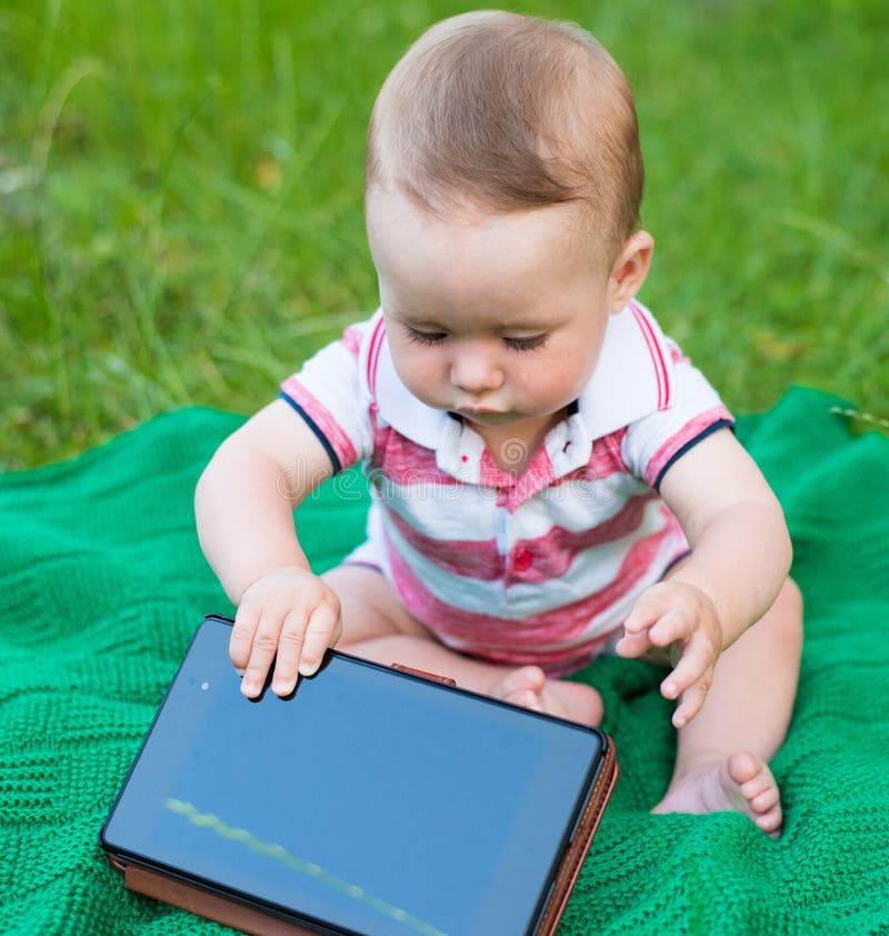 Baby boy with tablet stock image. Image of education - 73593077
