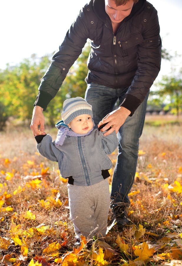 Baby Boy Taking First Steps with Father Help Stock Image - Image of ...