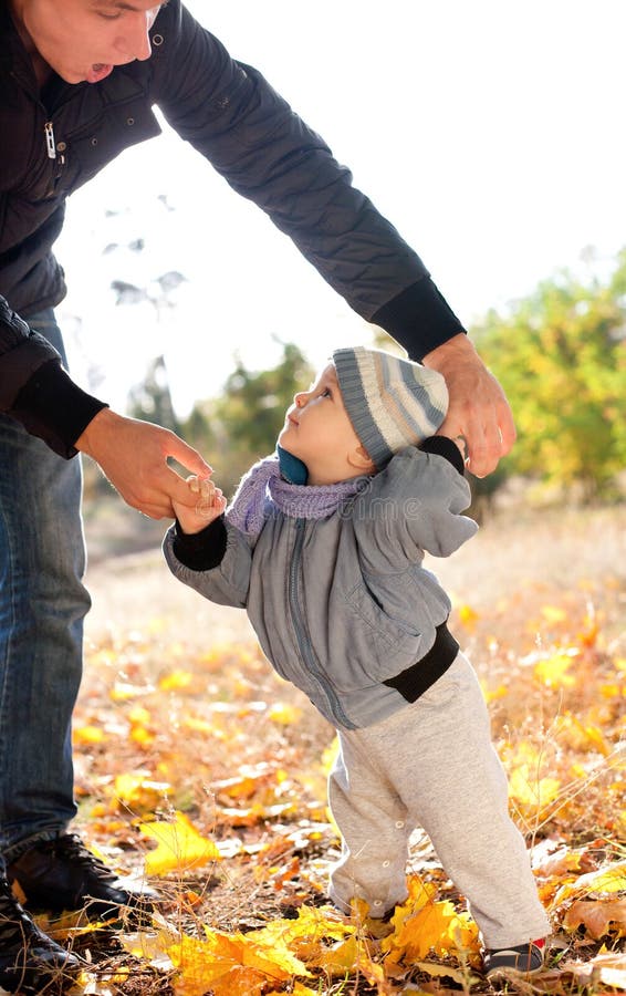 Baby Boy Taking First Steps with Father Help Stock Image - Image of ...