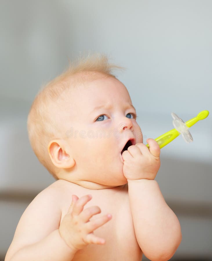 Baby boy with toothbrush stock photo. Image of infant - 77396034