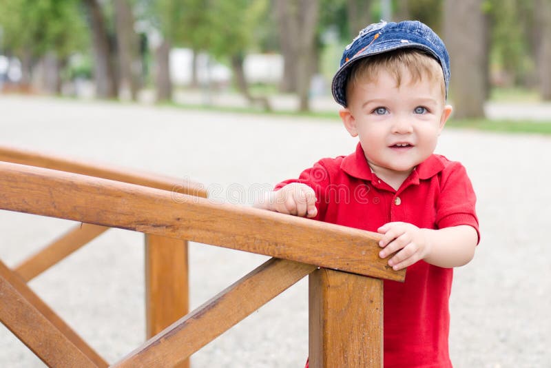 Baby boy on wooden bridge stock photo. Image of relax - 29499484
