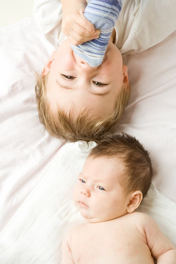 Baby brothers stock image. Image of face, closeup, sheet - 3651055