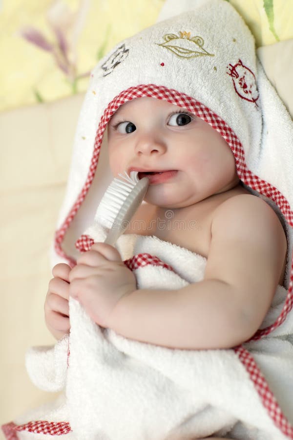 Baby with brush stock image. Image of objects, cute, lying - 24046293