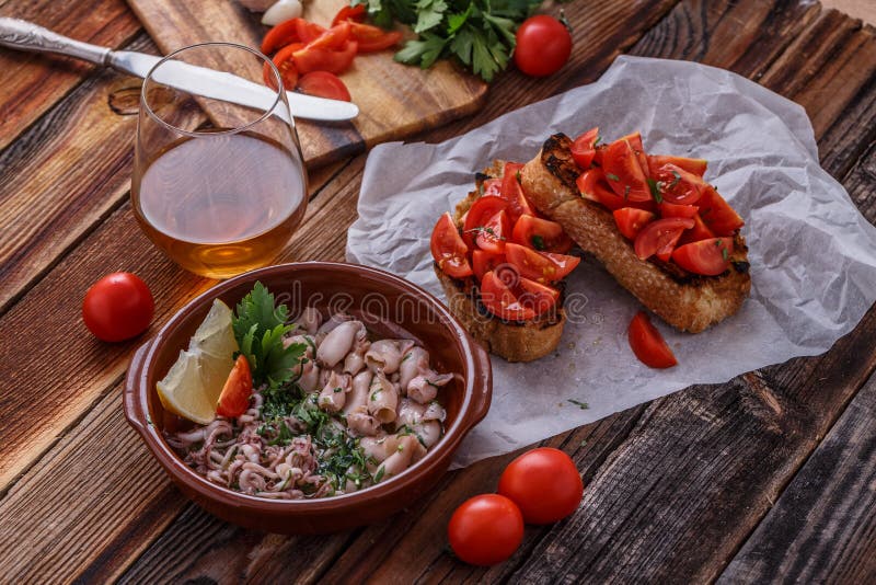 Baby Calamari with Bruschettas and Wine, Top View Stock Photo - Image ...