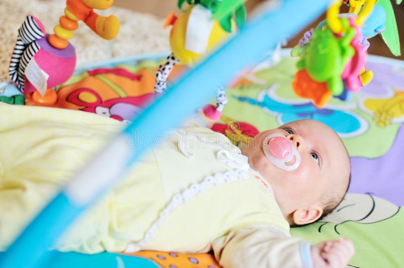 Baby on the carpet stock photo. Image of baby, lovely - 75723060