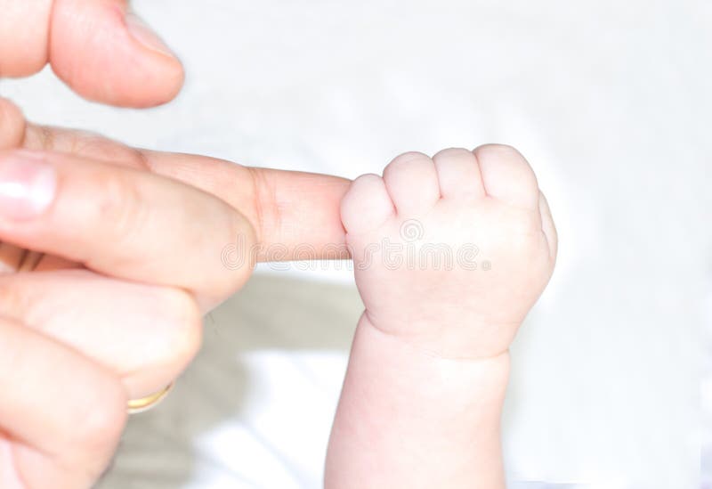 Baby Catching Mothers Finger Stock Image - Image of life, infancy: 34290947