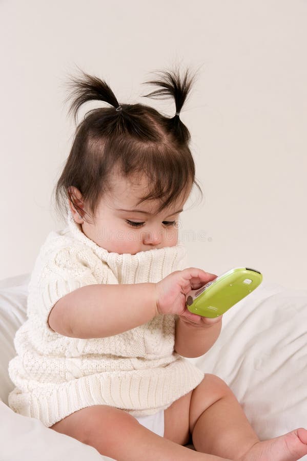 Baby with Cell Phone in Hand Stock Image - Image of dress, cell: 7918645