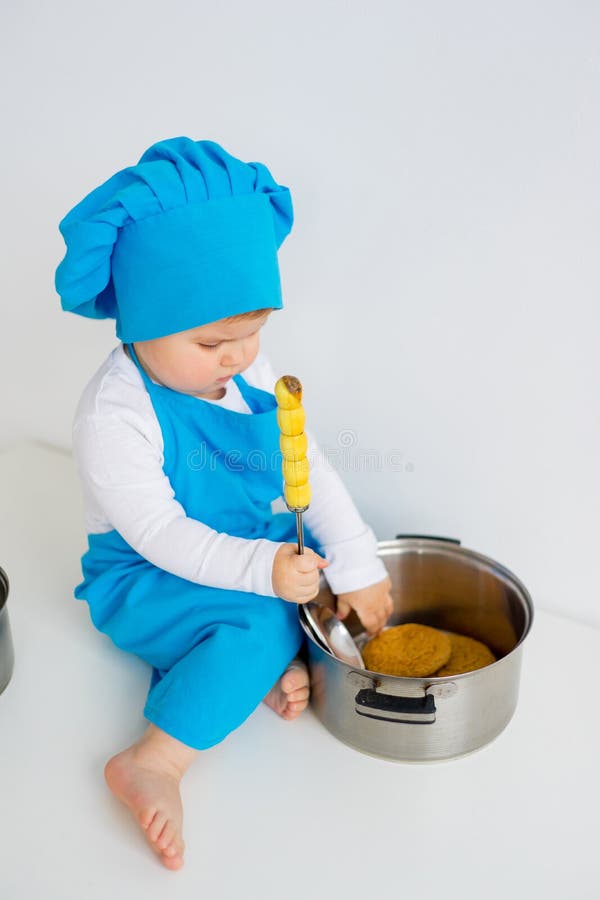 Baby in chef hat stock image. Image of pretty, kitchen - 106726085