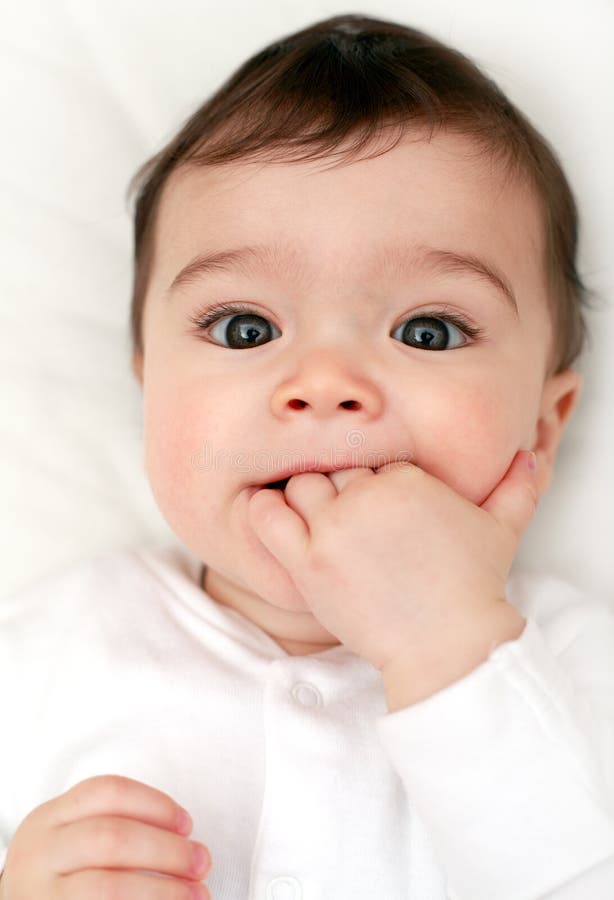 Baby chewing fingers stock image. Image of infant, adorable - 24725609