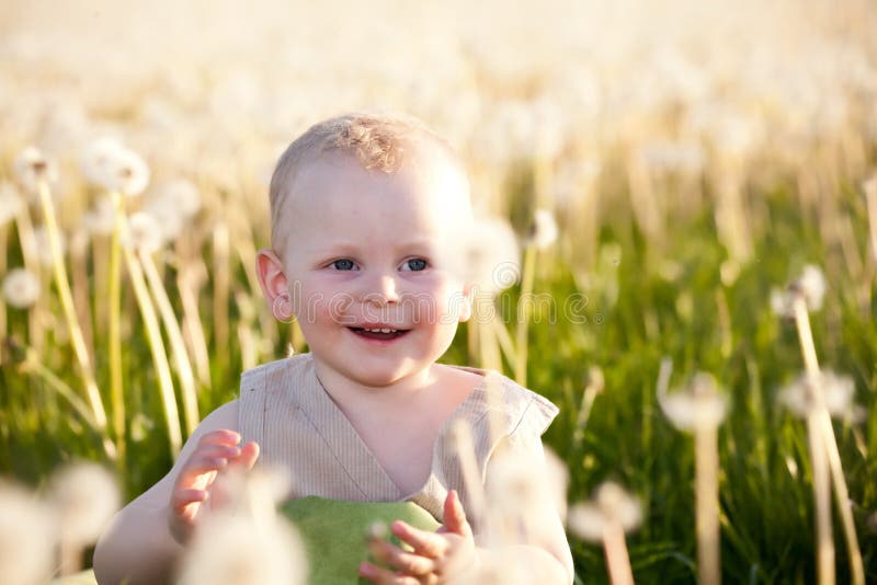Children in spring field stock photo. Image of baby, spring - 22727942