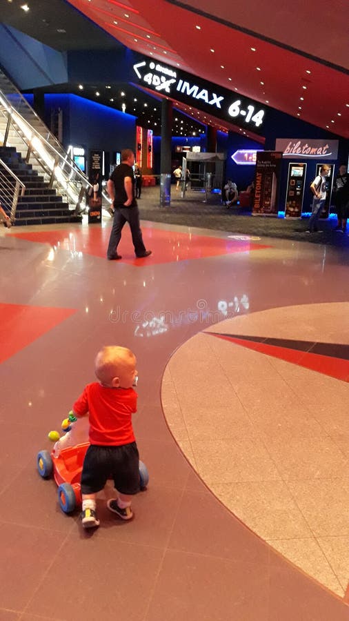 Baby in the cinema editorial image. Image of baby, imax - 99529085
