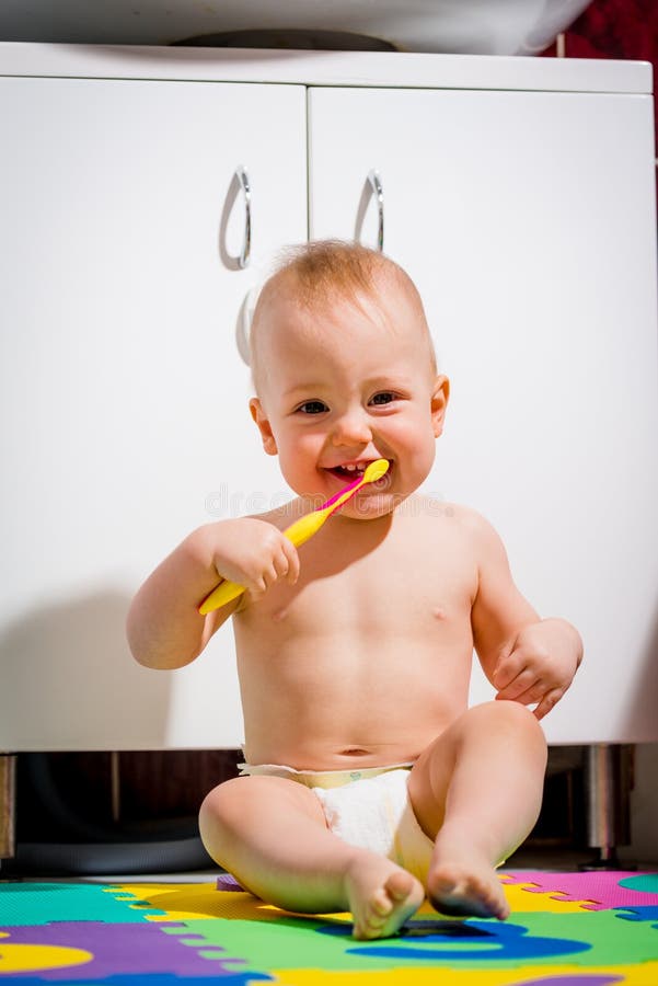 Baby Cleaning Teeth in Bathroom Stock Image - Image of candid, real ...