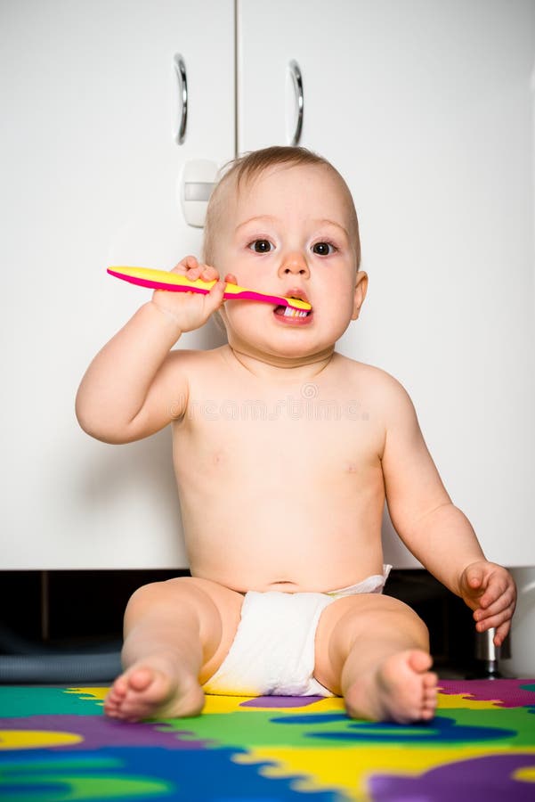 Baby Cleaning Teeth in Bathroom Stock Image - Image of candid, real ...