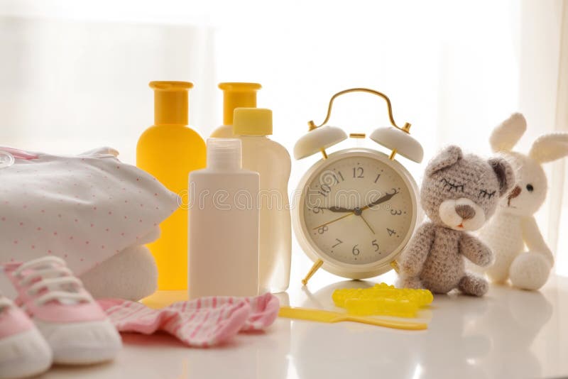 Baby Clothes, Cosmetics and Accessories on Table Stock Photo - Image of ...