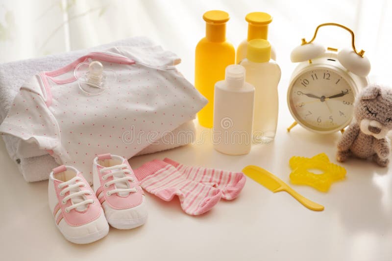 Baby Clothes, Cosmetics and Accessories on Table Stock Image - Image of ...