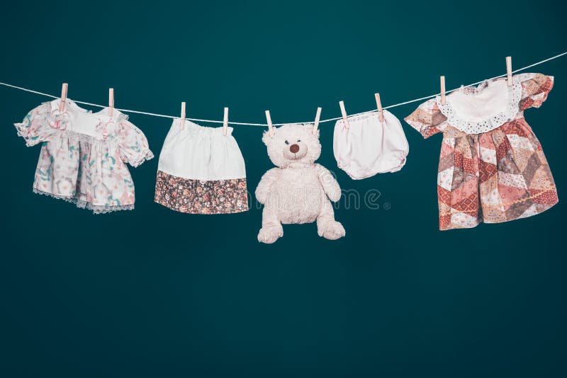 Baby Clothes Hanging on the Rope on Blue Background Stock Image - Image ...