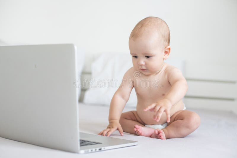 A Baby and a Computer, Head Shot Laptop Stock Photo - Image of front ...