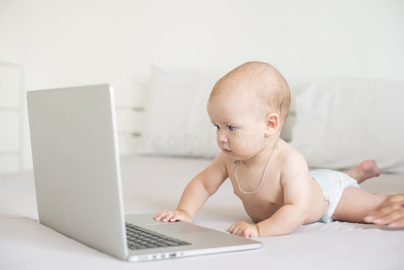 A Baby and a Computer, Head Shot Laptop Editorial Photography - Image ...