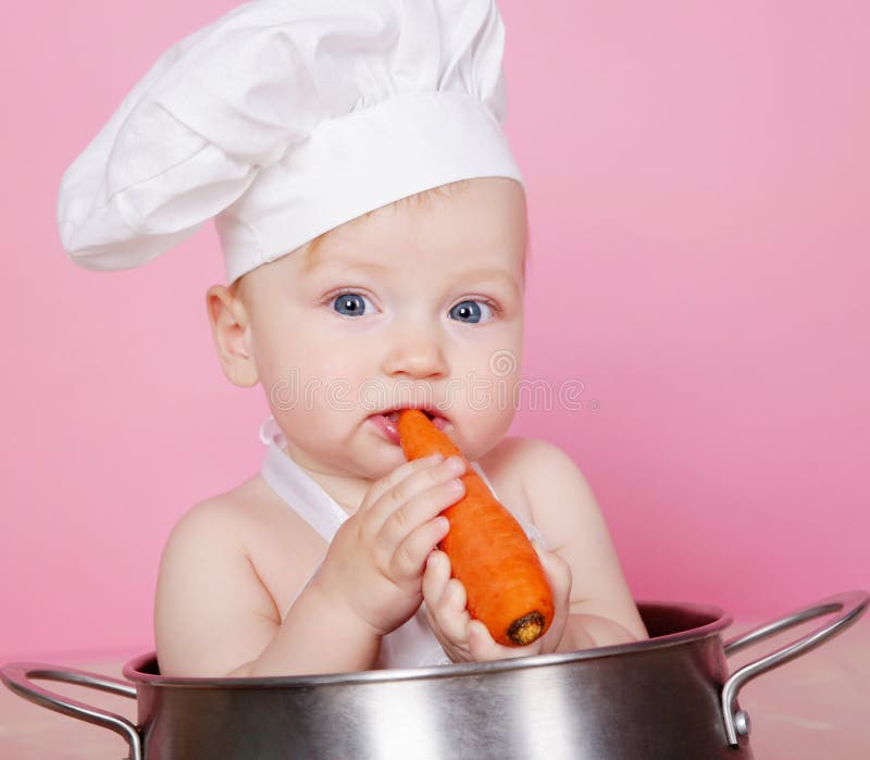 Baby Cook Girl Wearing Chef Hat with Fresh Vegetables. Stock Photo ...