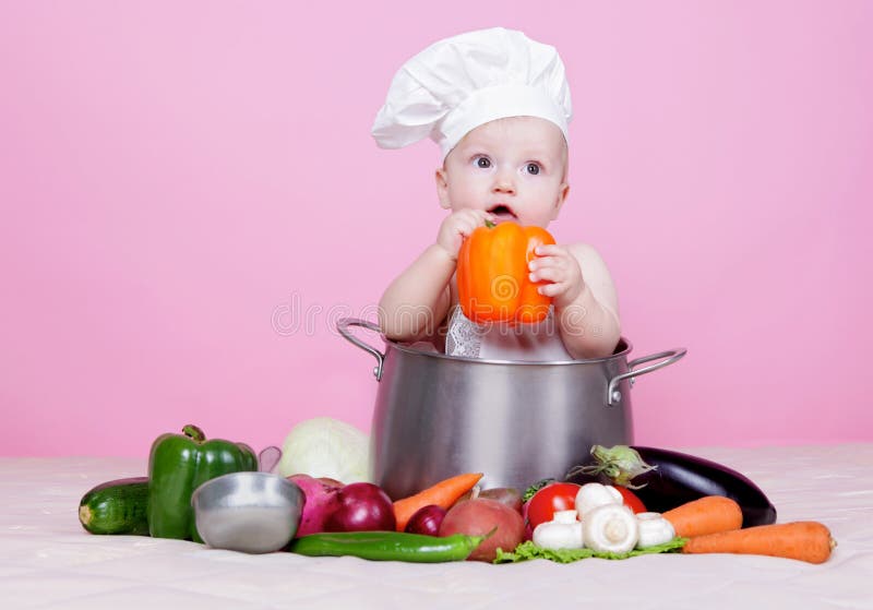 Baby Cook Girl Wearing Chef Hat with Fresh Vegetables and Fruits. Stock ...