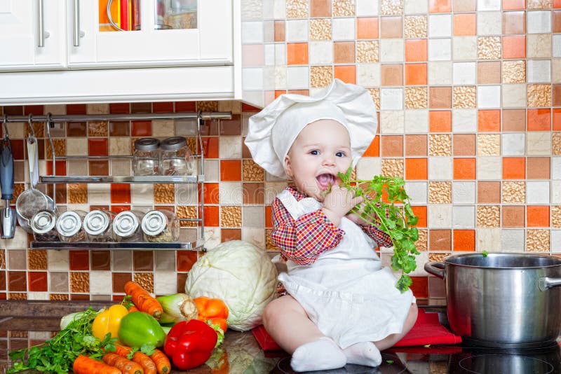 Baby Cook Girl Wearing Chef Hat with Fresh Vegetables and Fruits. Stock ...
