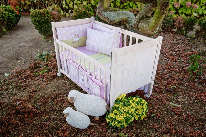 Baby cot bed in garden stock photo. Image of garden, clothes - 29298366