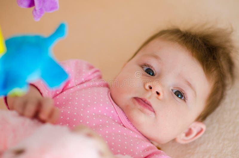 Baby in a cot stock photo. Image of months, girl, child - 76672688