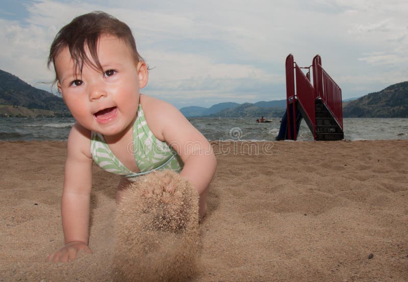 Baby Crawling on Sand stock image. Image of beautiful - 26628757