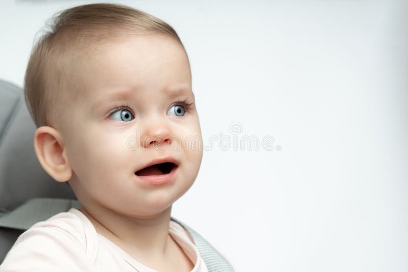 A Baby is Crying while Sitting in a Chair Stock Image - Image of ...