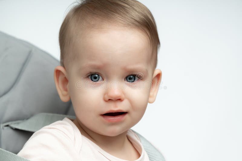 A Baby is Crying while Sitting in a Chair Stock Image - Image of ...