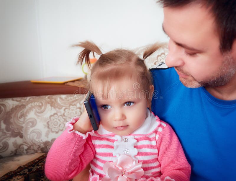 Baby calls on phone stock photo. Image of laugh, highkey - 1082844