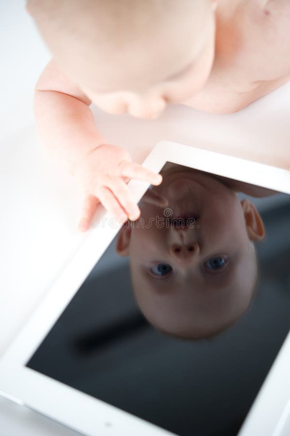 Baby with digital tablet stock image. Image of apple - 28863669