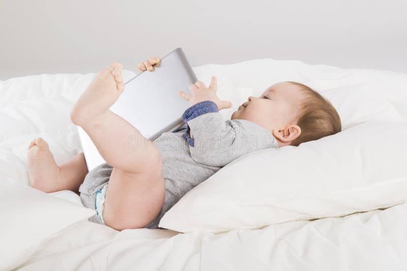 Baby with digital tablet stock image. Image of interior - 38225307