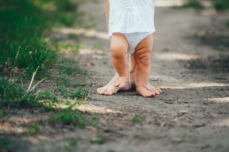 Baby Doing First Steps with Mother`s Help. Closeup Stock Image - Image ...