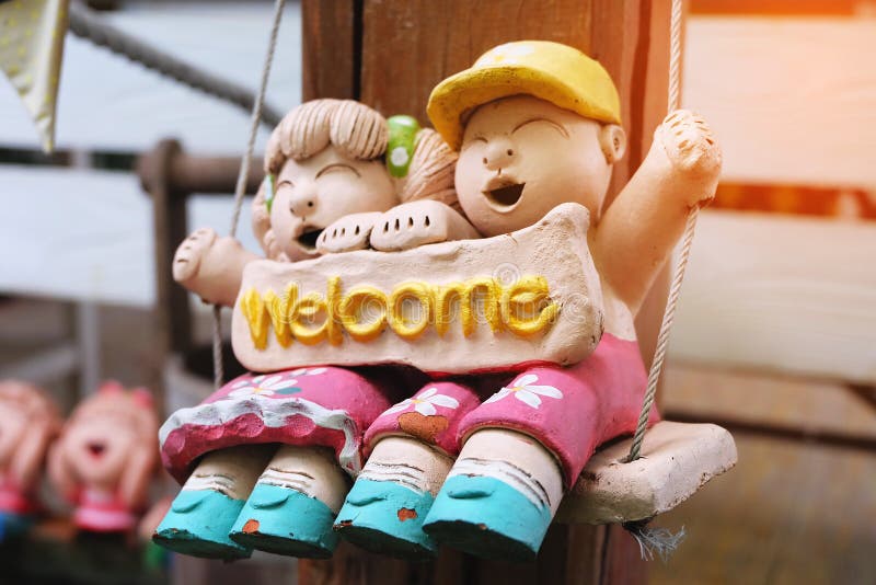 Baby Doll Couple with `welcome` Stock Photo - Image of clay, welcome ...