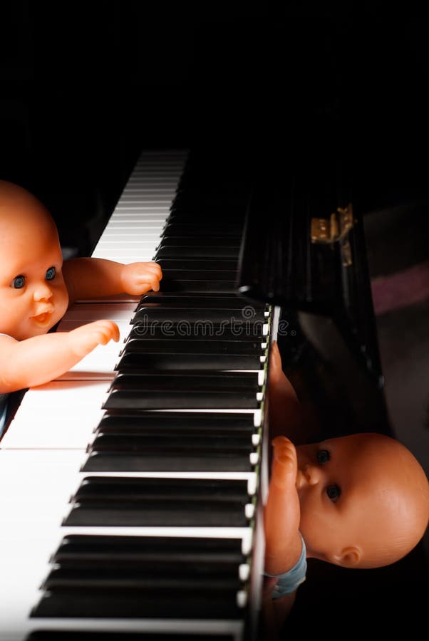 Baby doll playing piano stock photo. Image of baby, instrument - 39694008