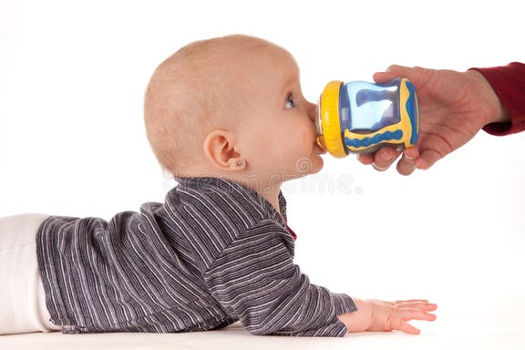Baby drinking from beaker stock photo. Image of baby - 22963984