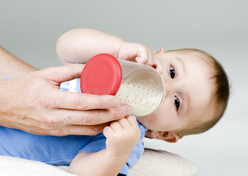 Baby Drinking Milk stock photo. Image of baby, plastic - 16883308