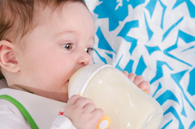 Baby Drinking Milk Formula from a Bottle Stock Photo - Image of drinks ...