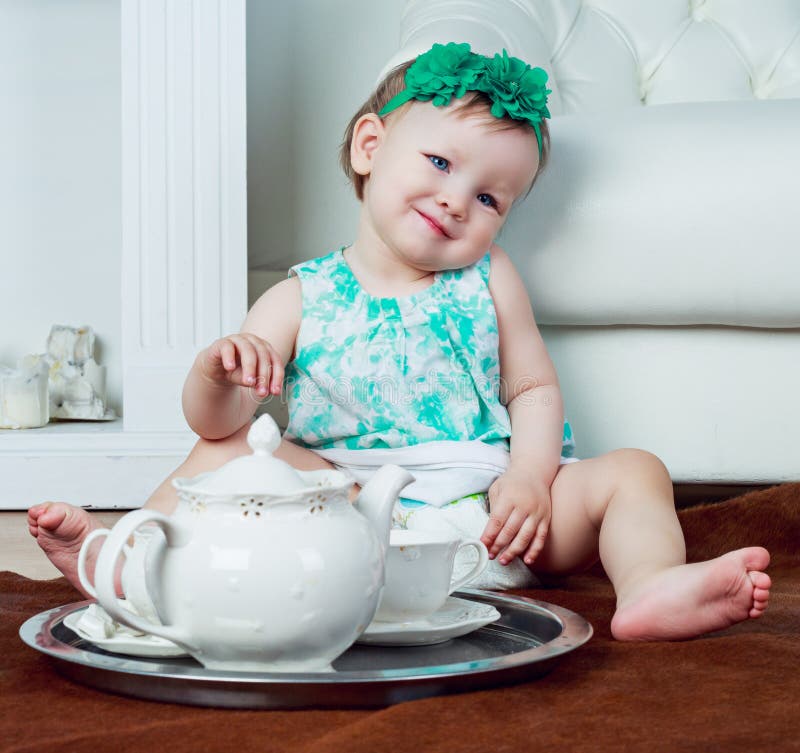 Baby drinking tea stock image. Image of happy, insides - 70029905