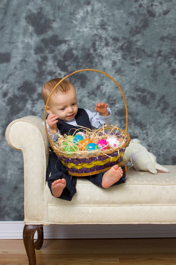 Baby with Easter basket stock image. Image of studio - 39117411