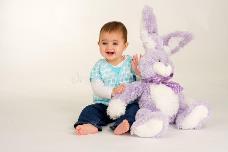 Baby with an Easter Bunny stock photo. Image of stuffed - 4974868