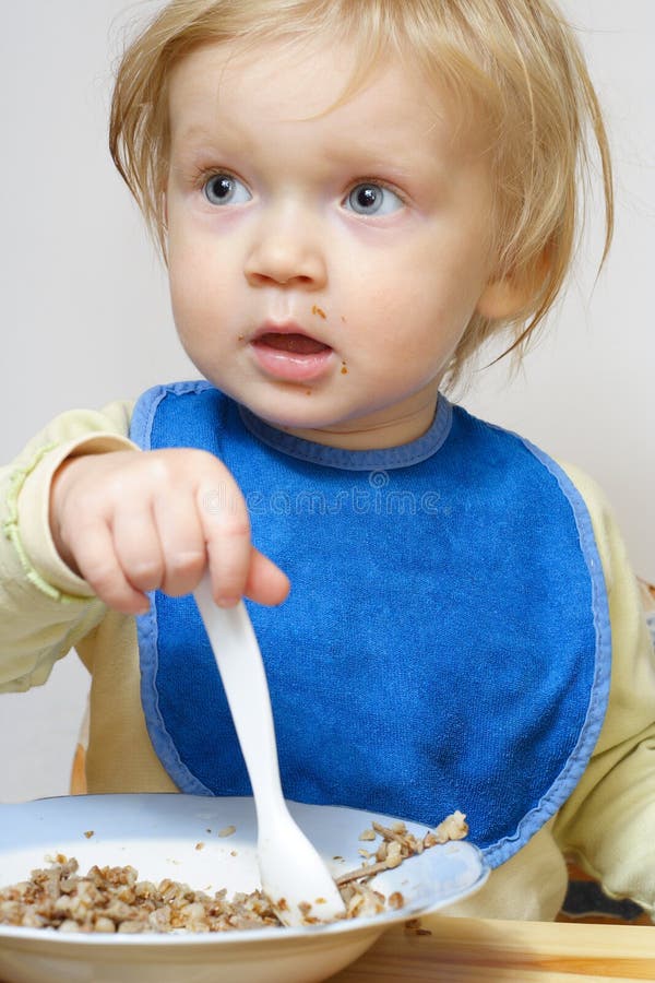 Baby eating stock photo. Image of food, messy, curiosity - 12450844