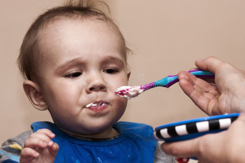 Baby eating stock photo. Image of beautiful, months, little - 16598706