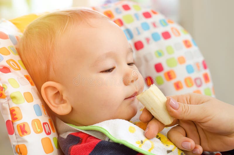 Baby eating banana stock image. Image of healthy, baby - 152604509