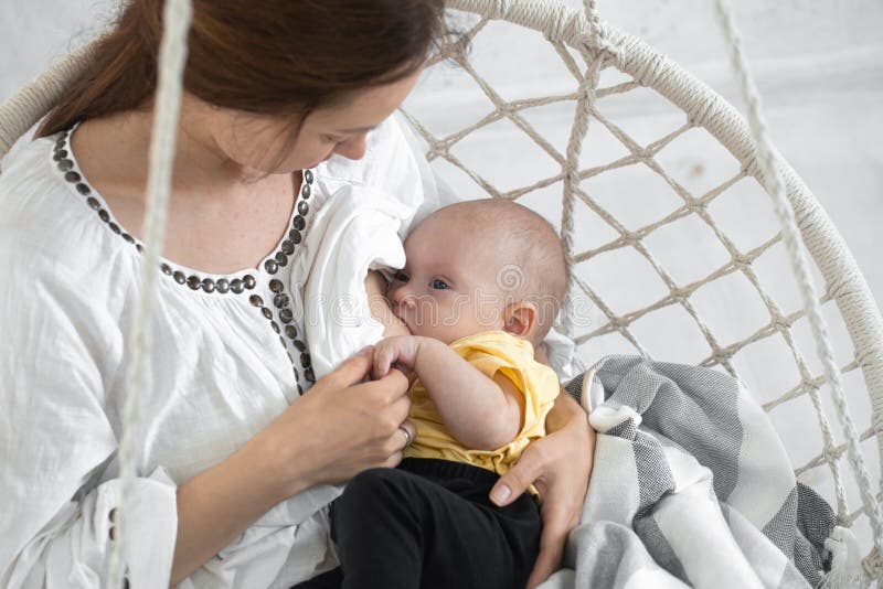 Baby Eating Breast Milk. Mother Breastfeeding Her Baby Boy. Concept of ... Baby Eating Breast Milk. Mother Breastfeeding Her Baby Boy. Concept of ...