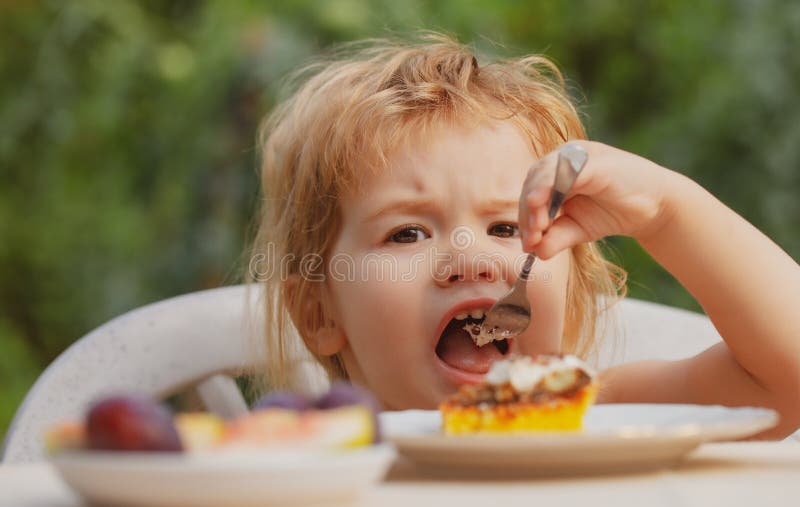 Baby Eating Cake. Child Eat Cupcake Outdoors. Stock Photo - Image of ...