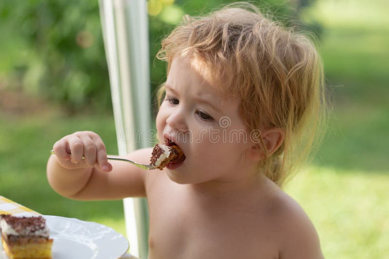 Baby Eating Cake. Cute Child Eats Delicious Outside. Stock Photo ...