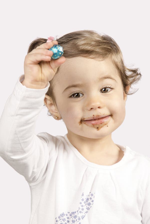Baby eating chocolate stock image. Image of kids, tasty - 69463479